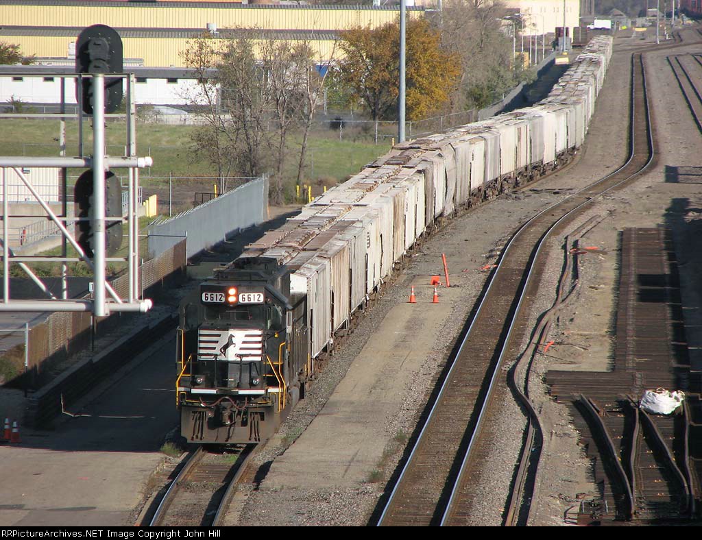 071103023 Eastbound NS unit train waits at BNSF Northtown CTC 44th for extra unit to be added
